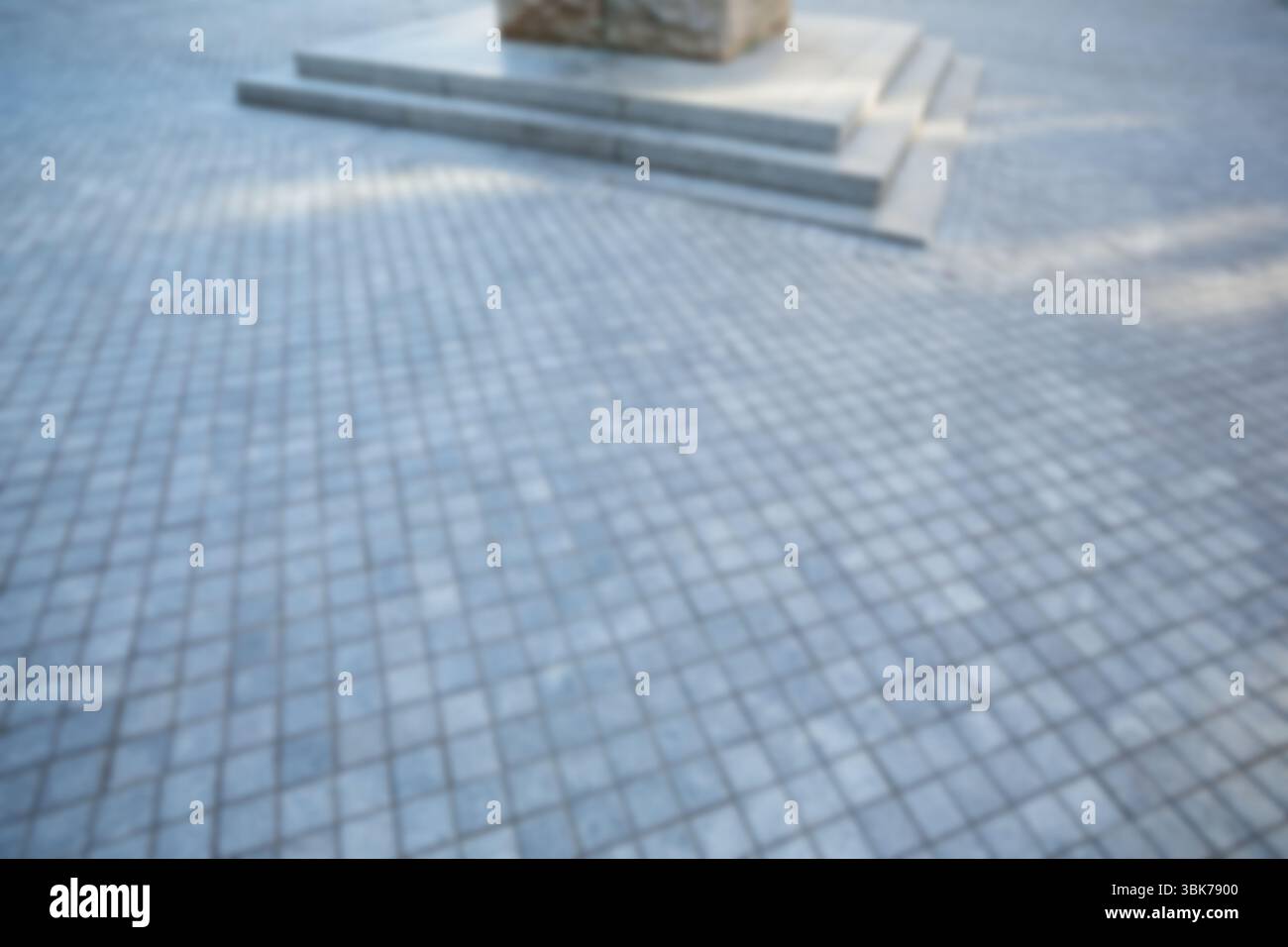 Defocused image of paved street Stock Photo - Alamy