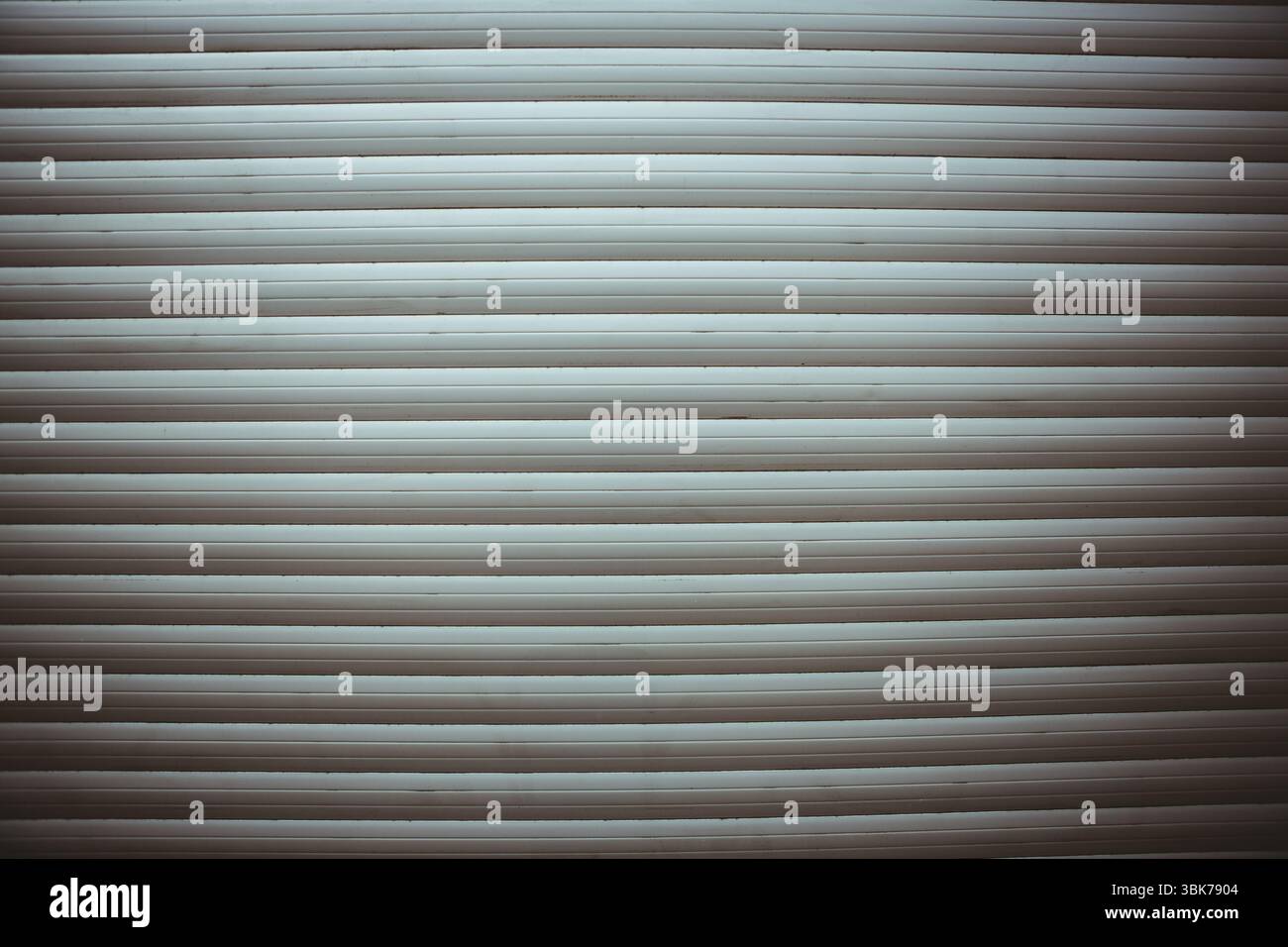 Flat design metal roller shutter door is covering storefront facade ...