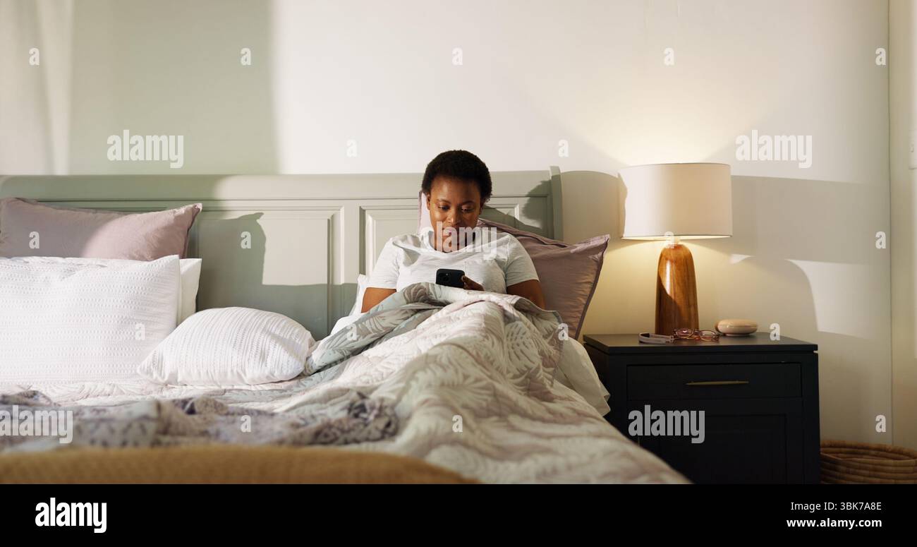 Reading, phone and wake up with black woman in bedroom for chat ...