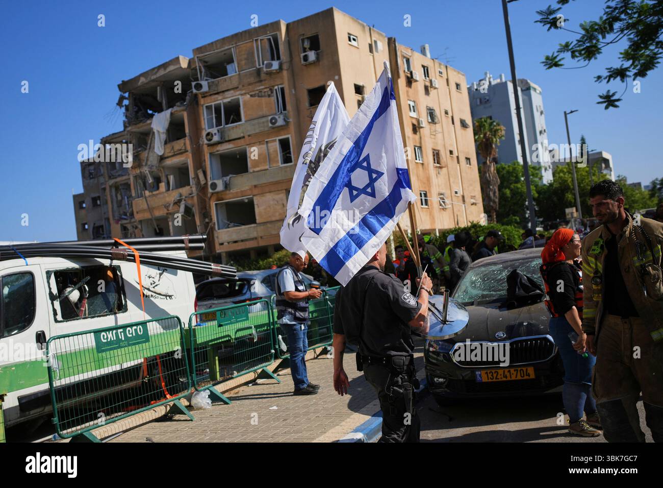 Israeli security forces inspect a heavily damaged building that were ...