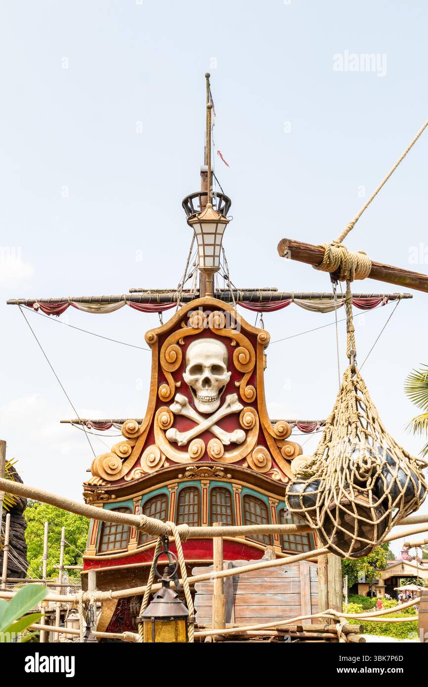 A partially visible pirate ship structure with skull and crossbones ...
