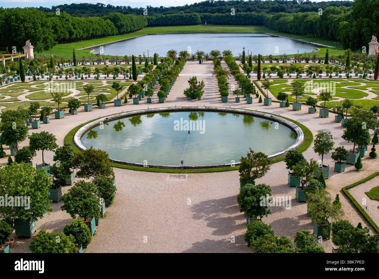 Overhead view of formal garden, featuring circular pool, gravel paths ...