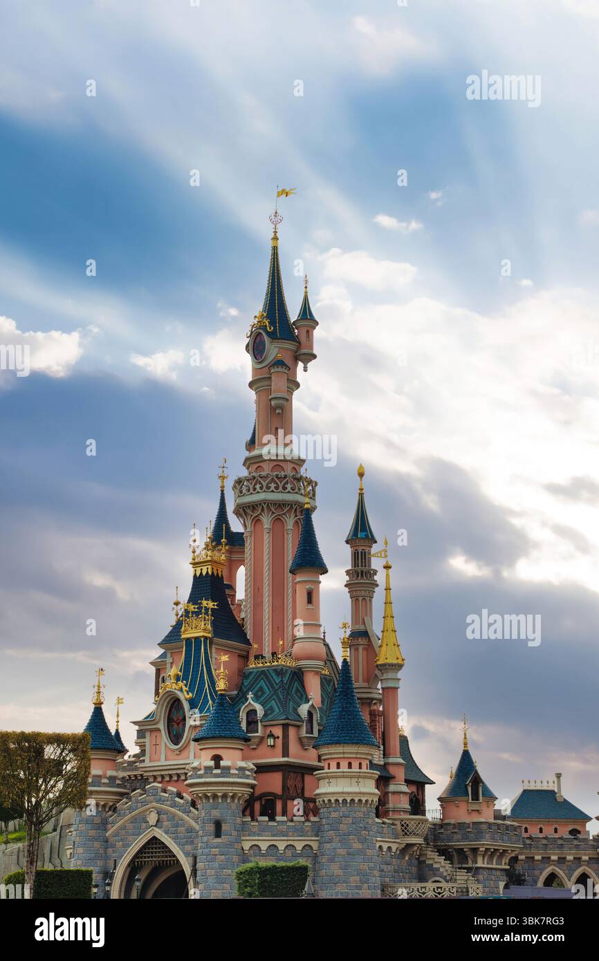 Detailed view of Sleeping Beauty Castle, with pink towers, blue roofs ...