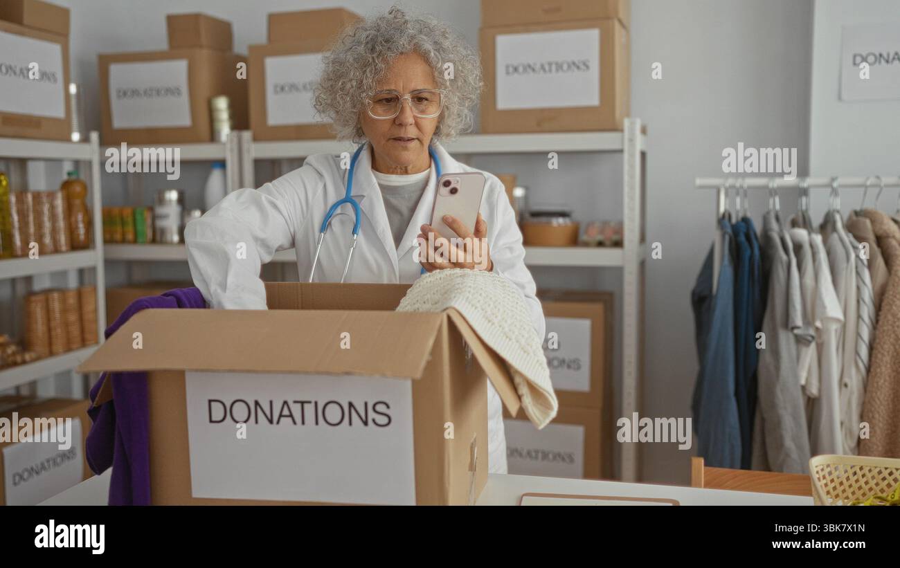 Woman organizing donations in a charitable indoor setting, examining ...