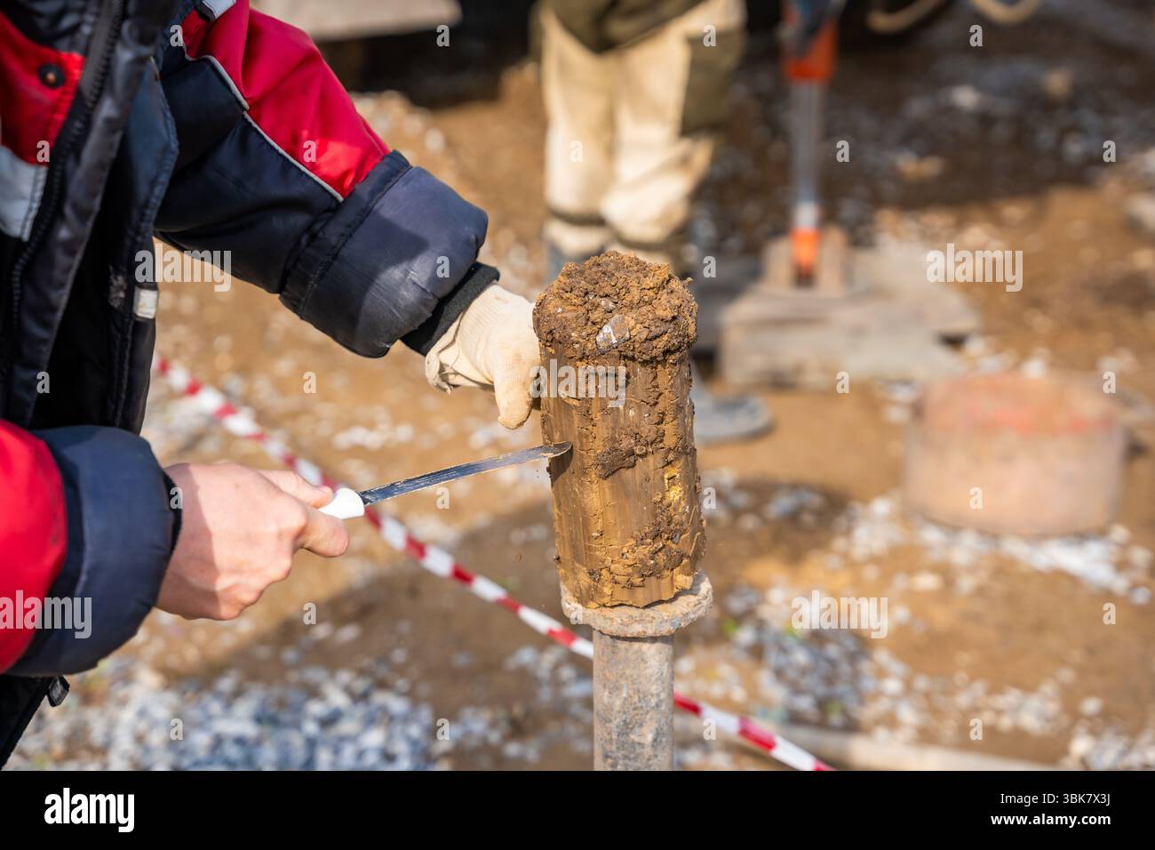 Man cutting cleaning soil sample hi-res stock photography and images ...