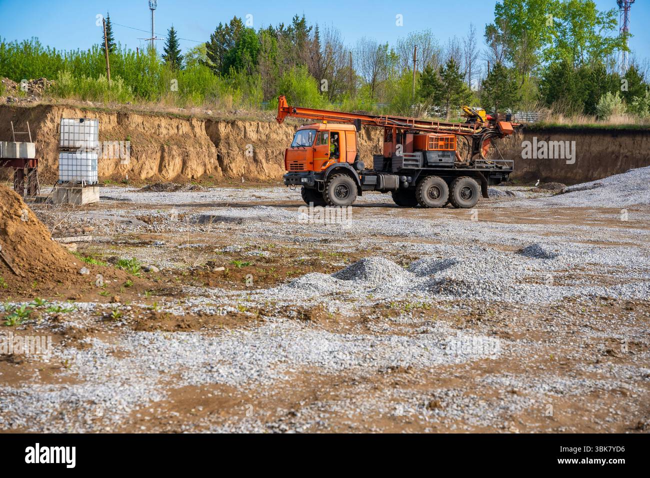 Construction site with heavy machinery preparing foundation for future ...