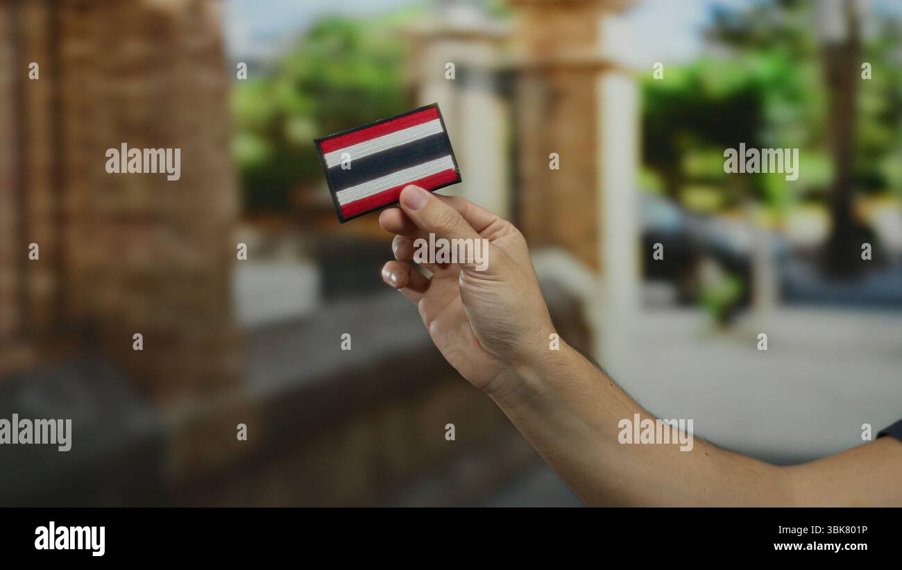 Man holding embroidered thai flag hi-res stock photography and images ...