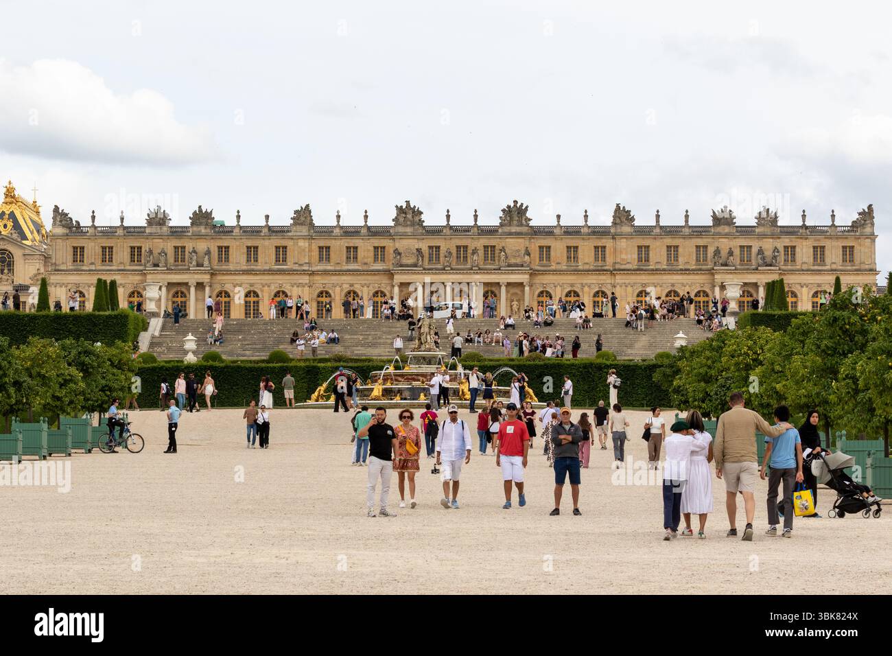 Palace of Versailles exterior, featuring a large crowd of people ...