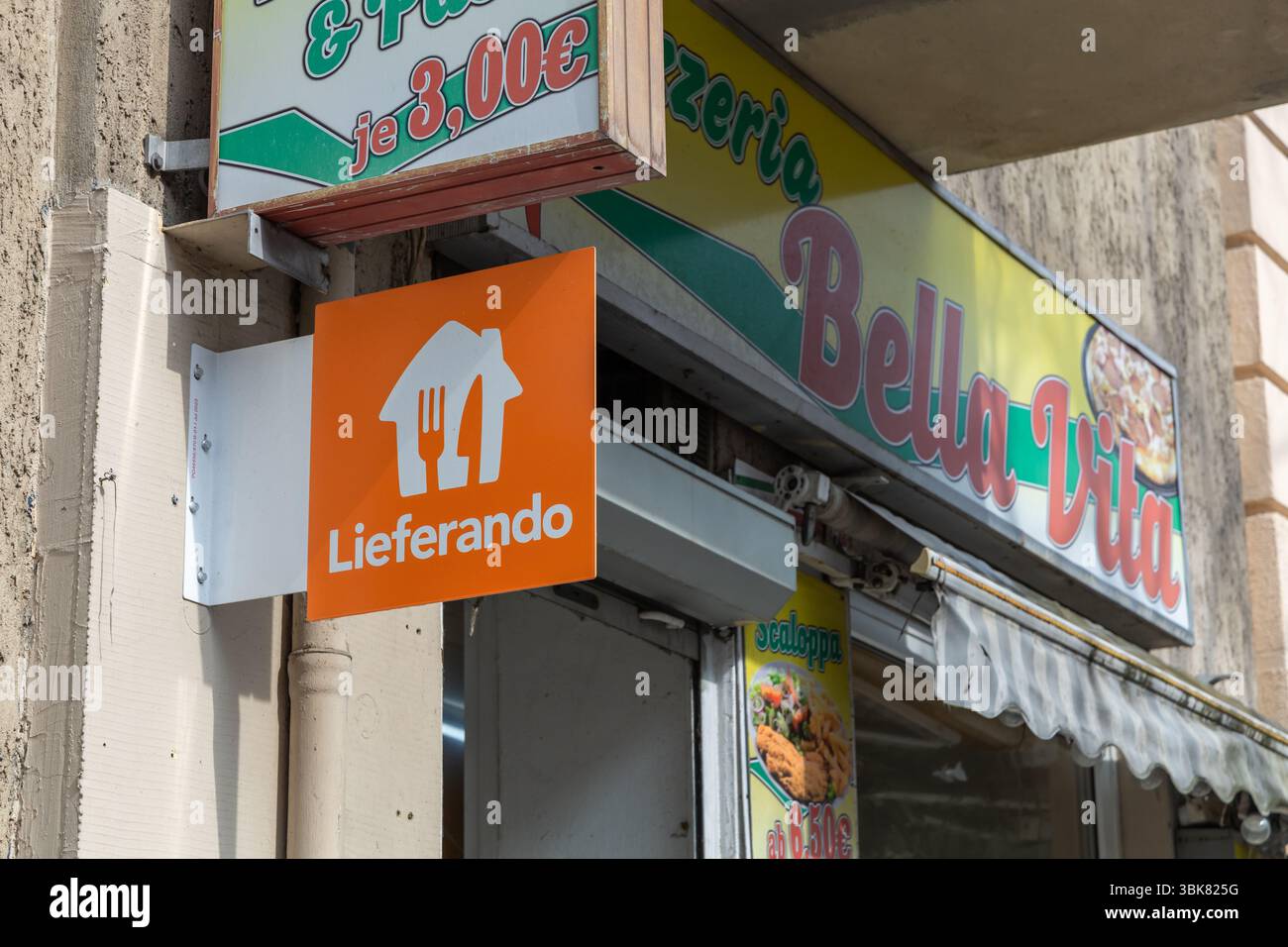 Lieferando logo sign outside a Pizzeria Bella Vita. Food delivery ...