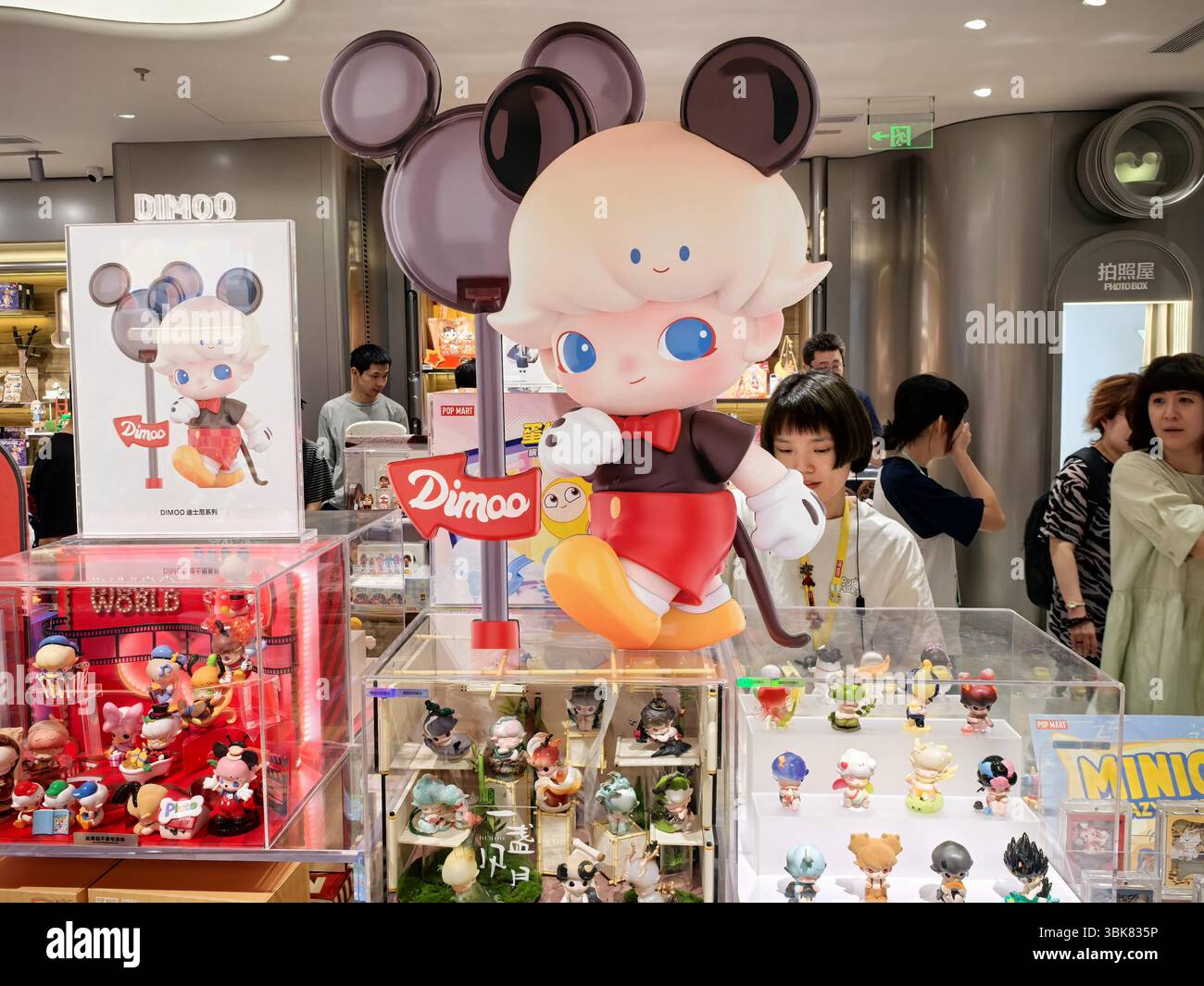 Customers buy Labubu products at a Pop Mart store in Beijing, China, 15 ...