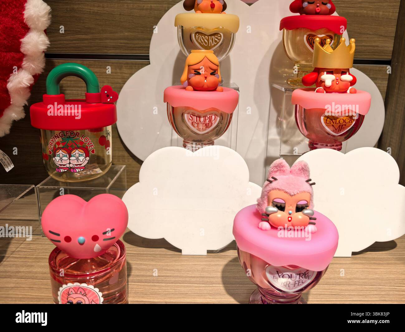 Customers buy Labubu products at a Pop Mart store in Beijing, China, 15 ...
