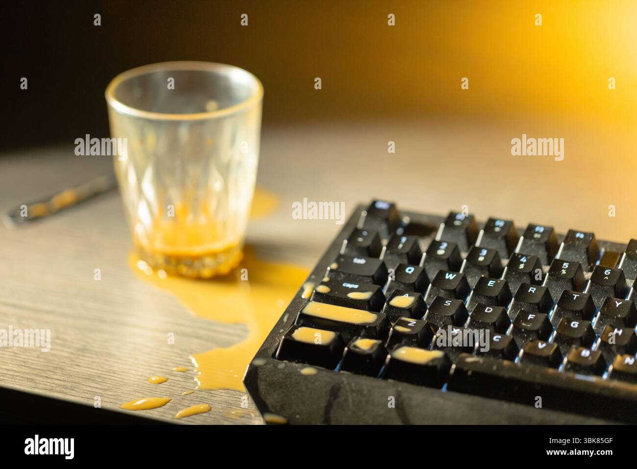 Coffee spilled on mechanical keyboard of computer closeup Stock Photo ...
