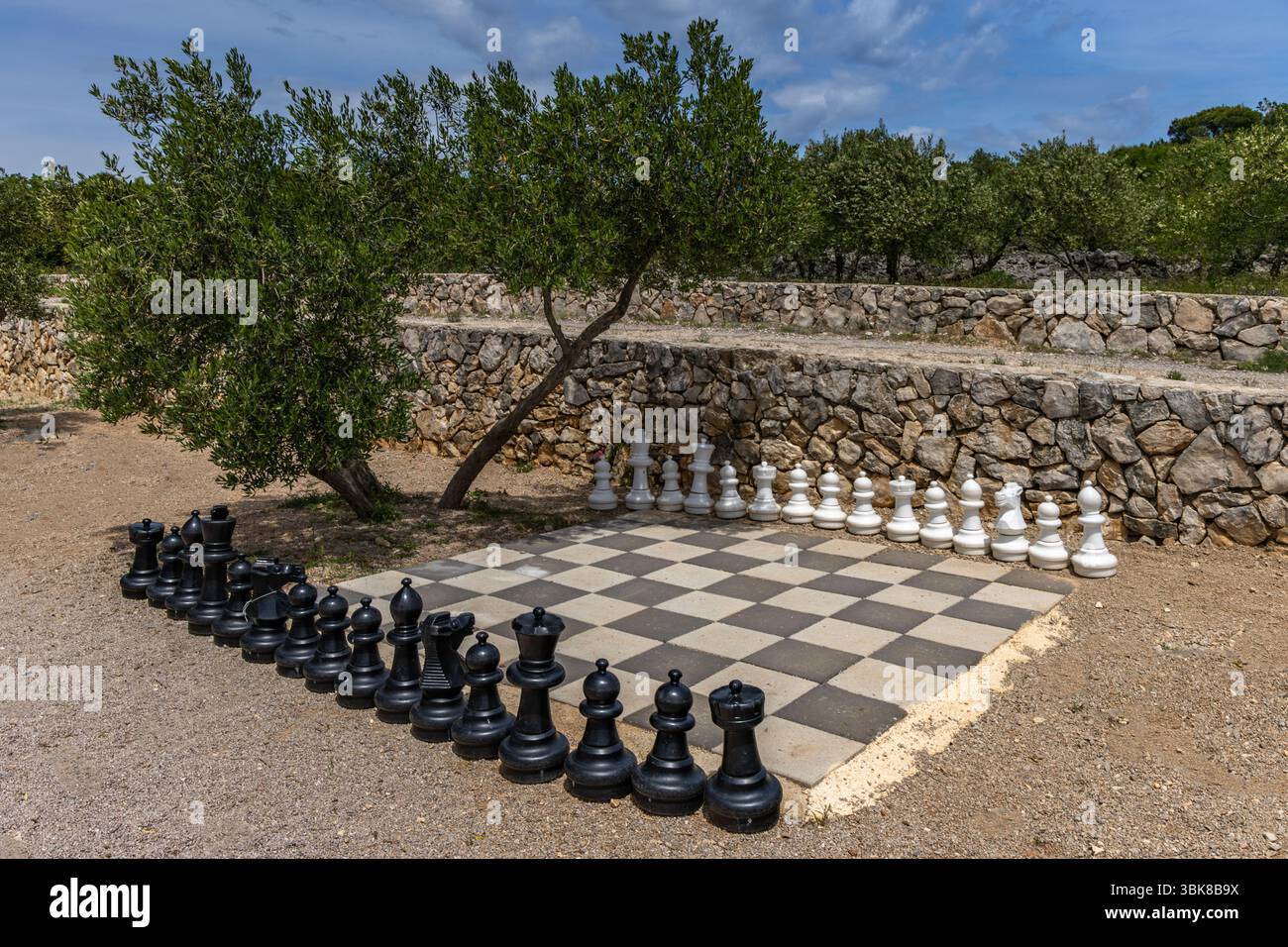 A chessboard with pawns and chess pieces on the beach in Punat, KRK ...