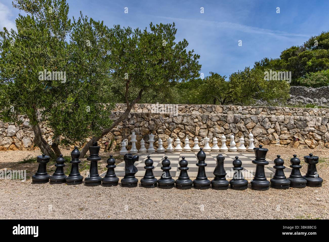 A chessboard with pawns and chess pieces on the beach in Punat, KRK ...