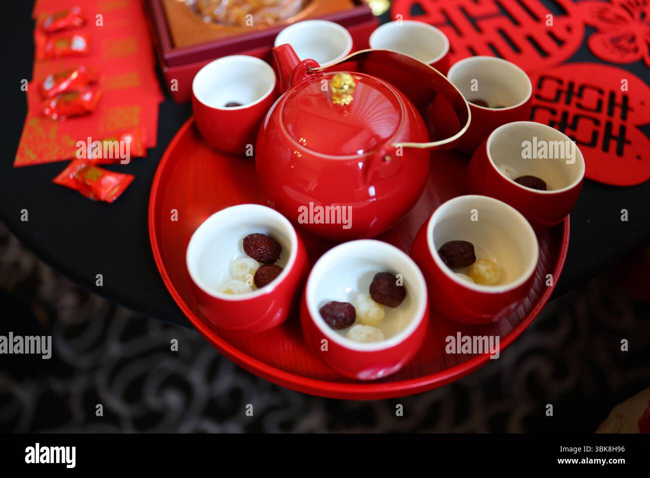 Elegant tea pouring ritual at Chinese event, highlighting cultural ...
