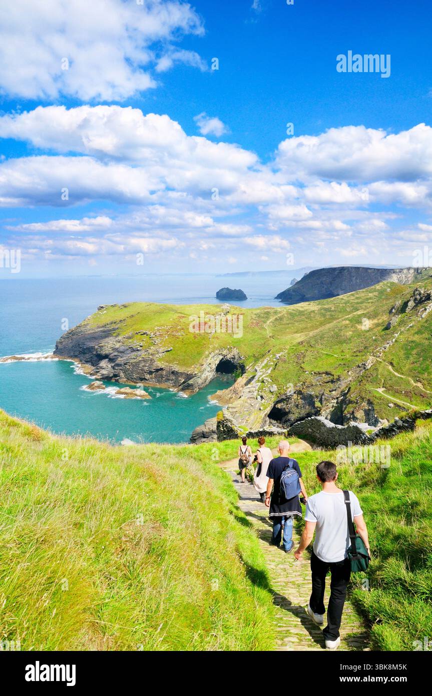Tourists walking circular route along dramatic coastline at Tintagel ...