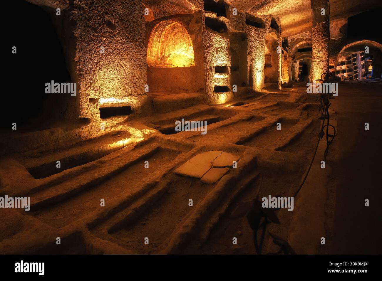Tunnels of catacombs underground with burial holes closeup Stock Photo ...