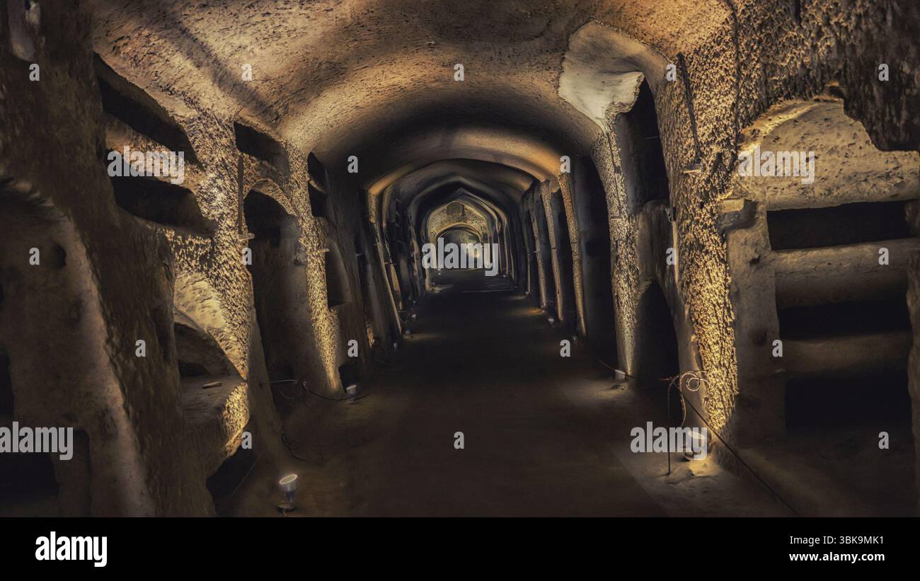 Tunnels of catacombs underground with burial holes closeup Stock Photo ...