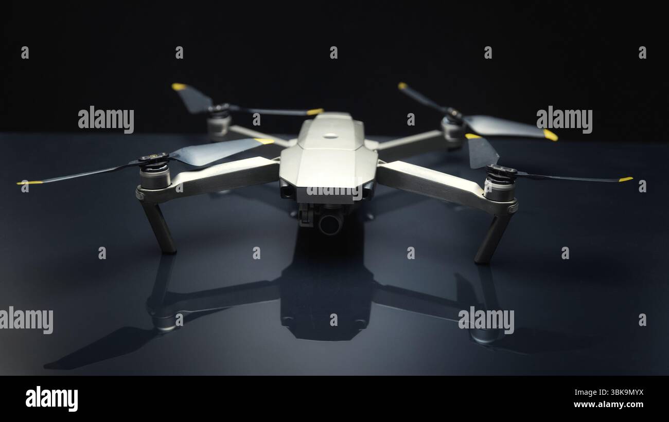 Grey drone against black background close up photo Stock Photo - Alamy