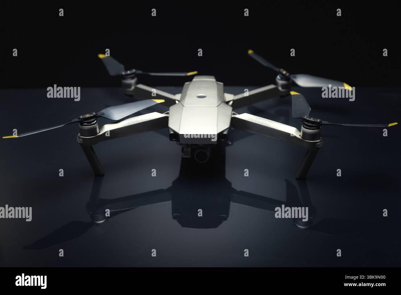 Grey drone against black background close up photo Stock Photo - Alamy