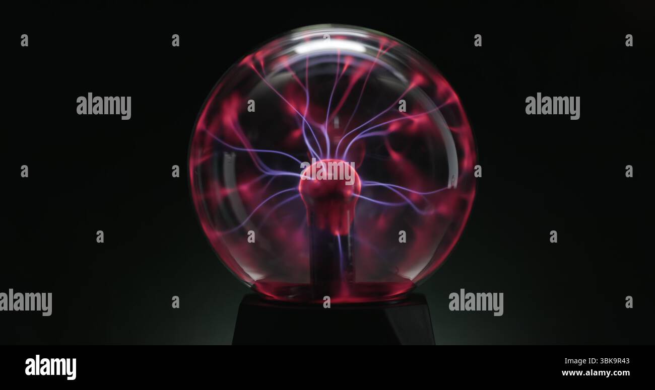 Electric coil inside glass sphere close up Stock Photo - Alamy