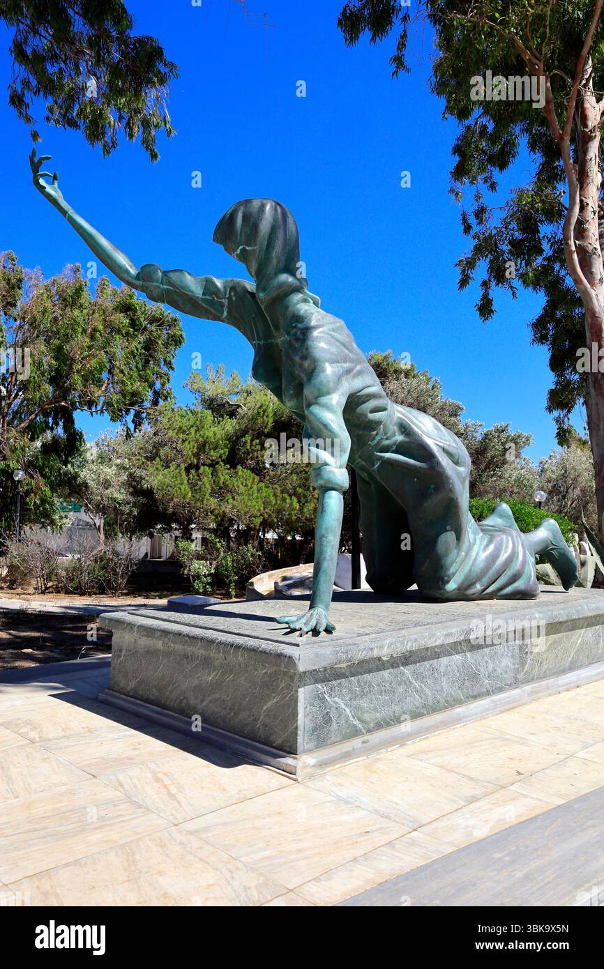 Bronze statue of faceless pilgrim on hands and knees crawling to the ...