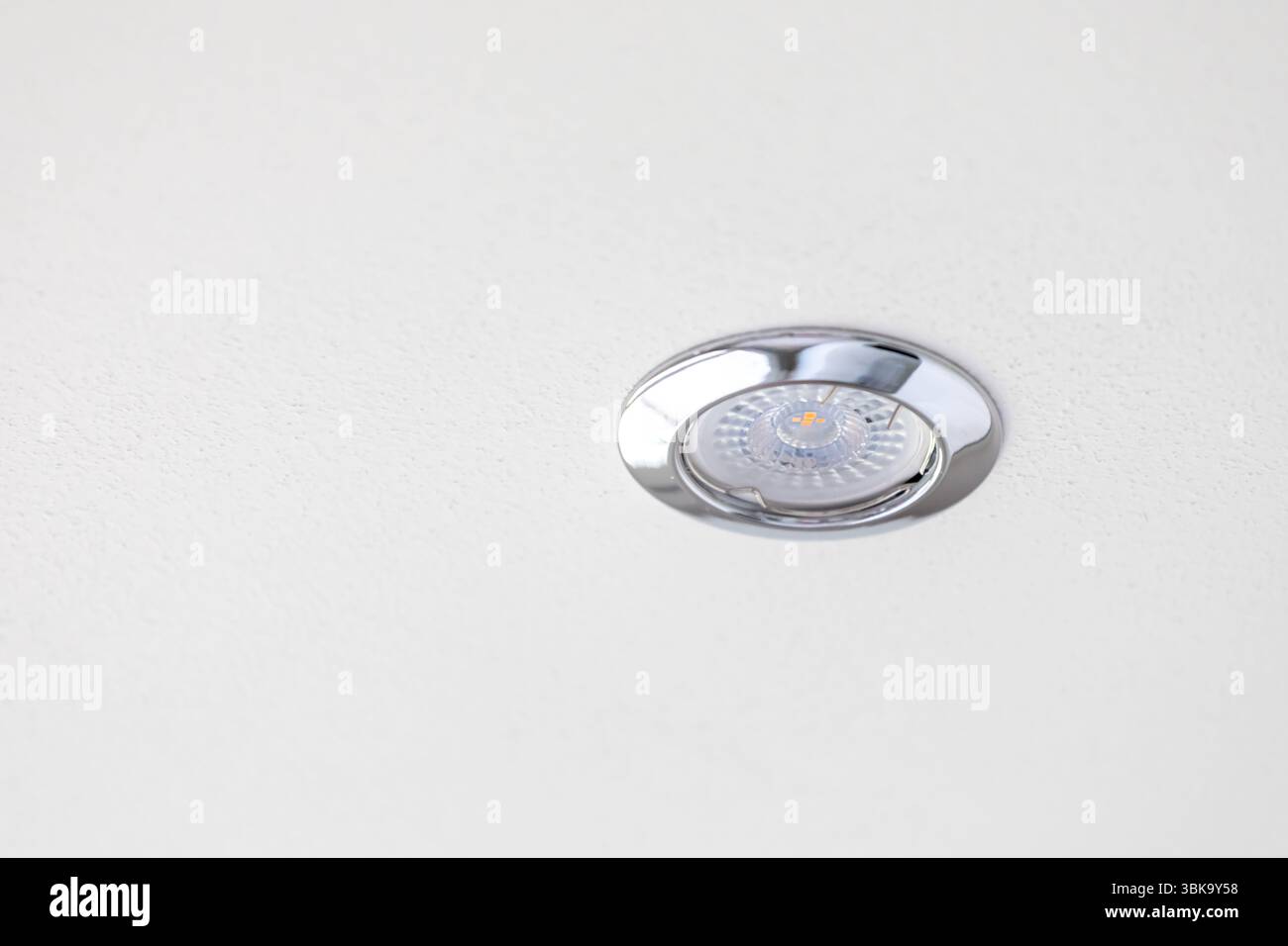 Small LED Spotlight Illuminating A Textured White Ceiling, Enhancing ...