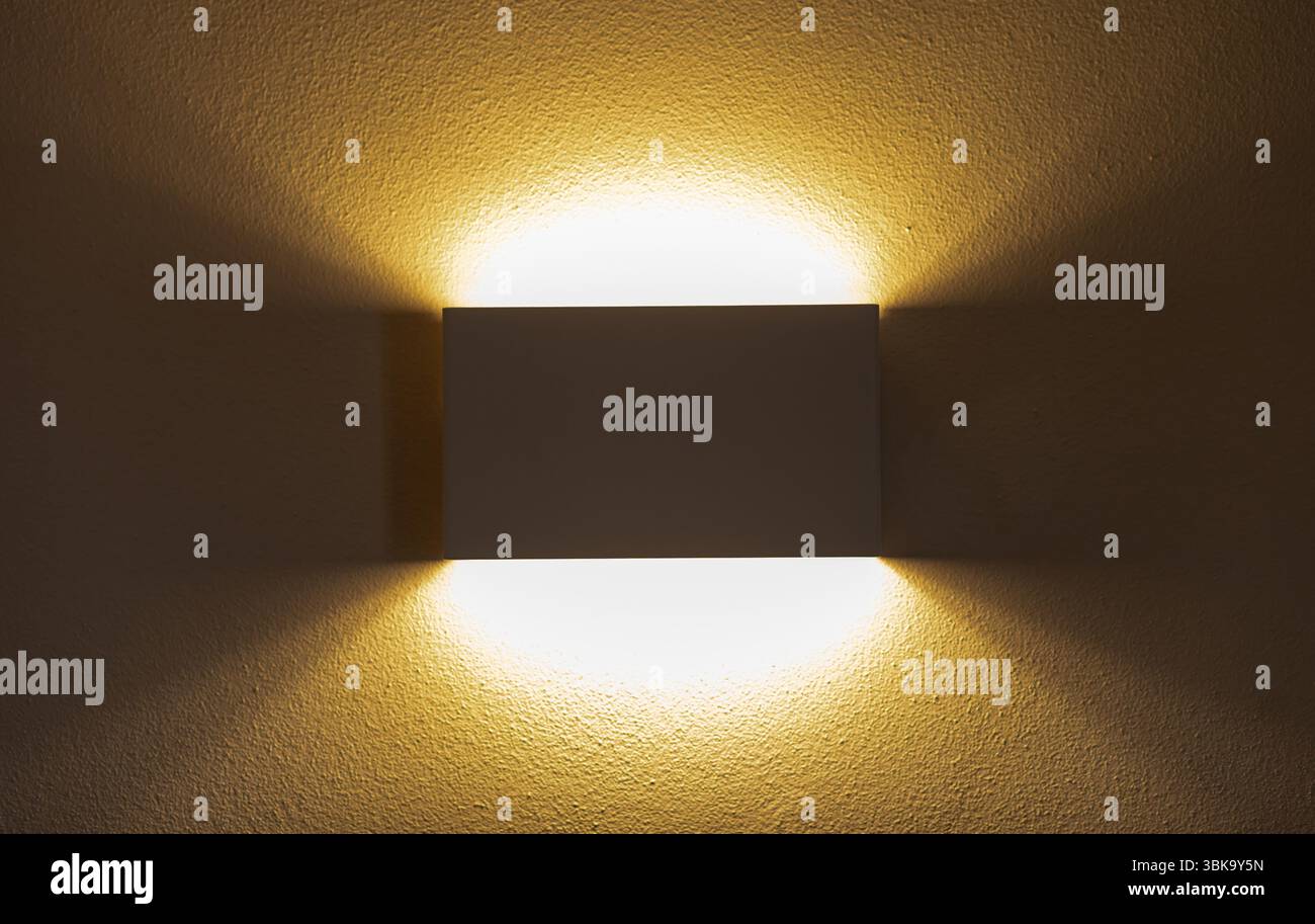 Casting A Warm, Inviting Glow Both Upwards And Downwards, A Modern Wall ...