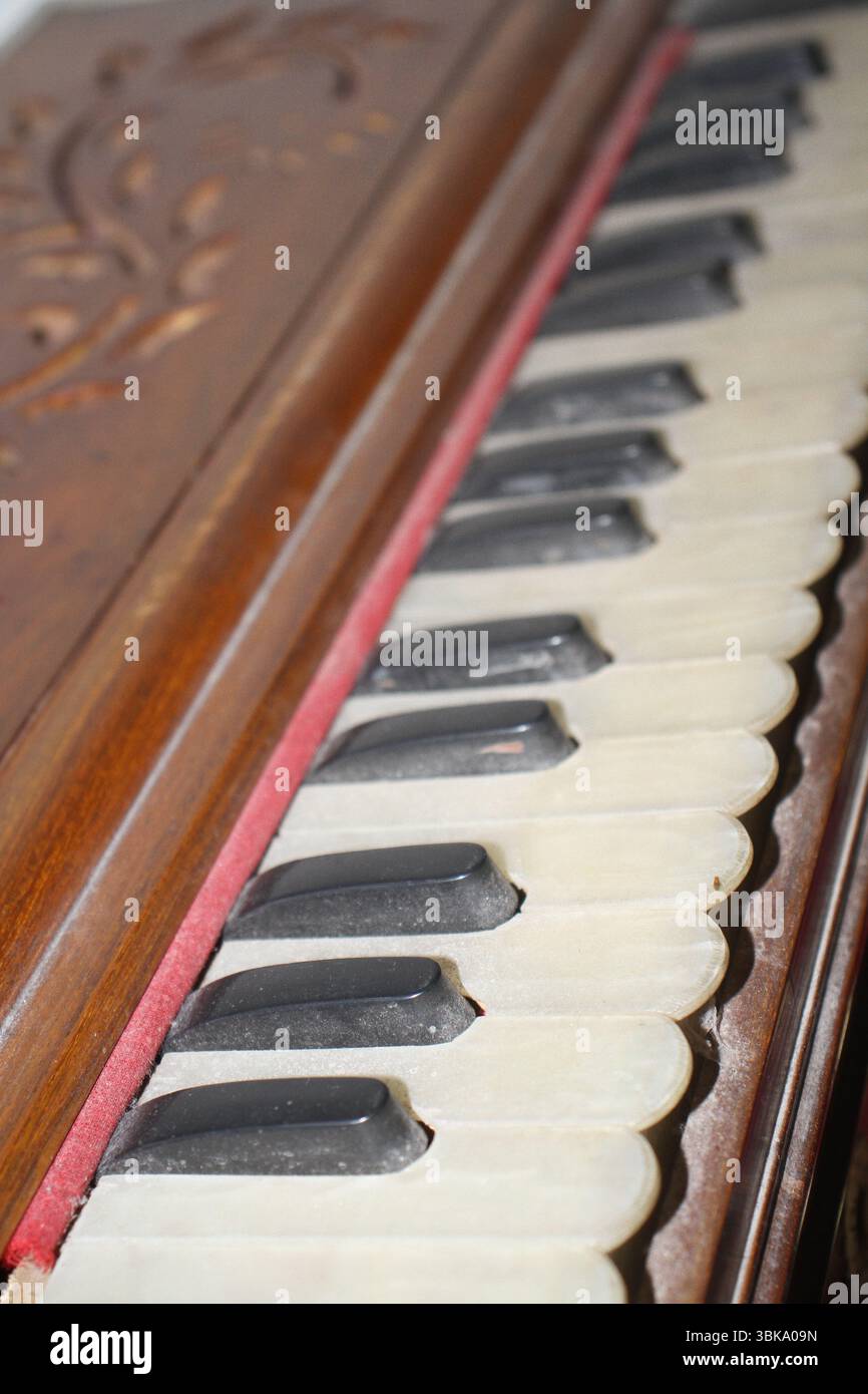 A traditional antique harmonium, a musical instrument, it has the ivory ...