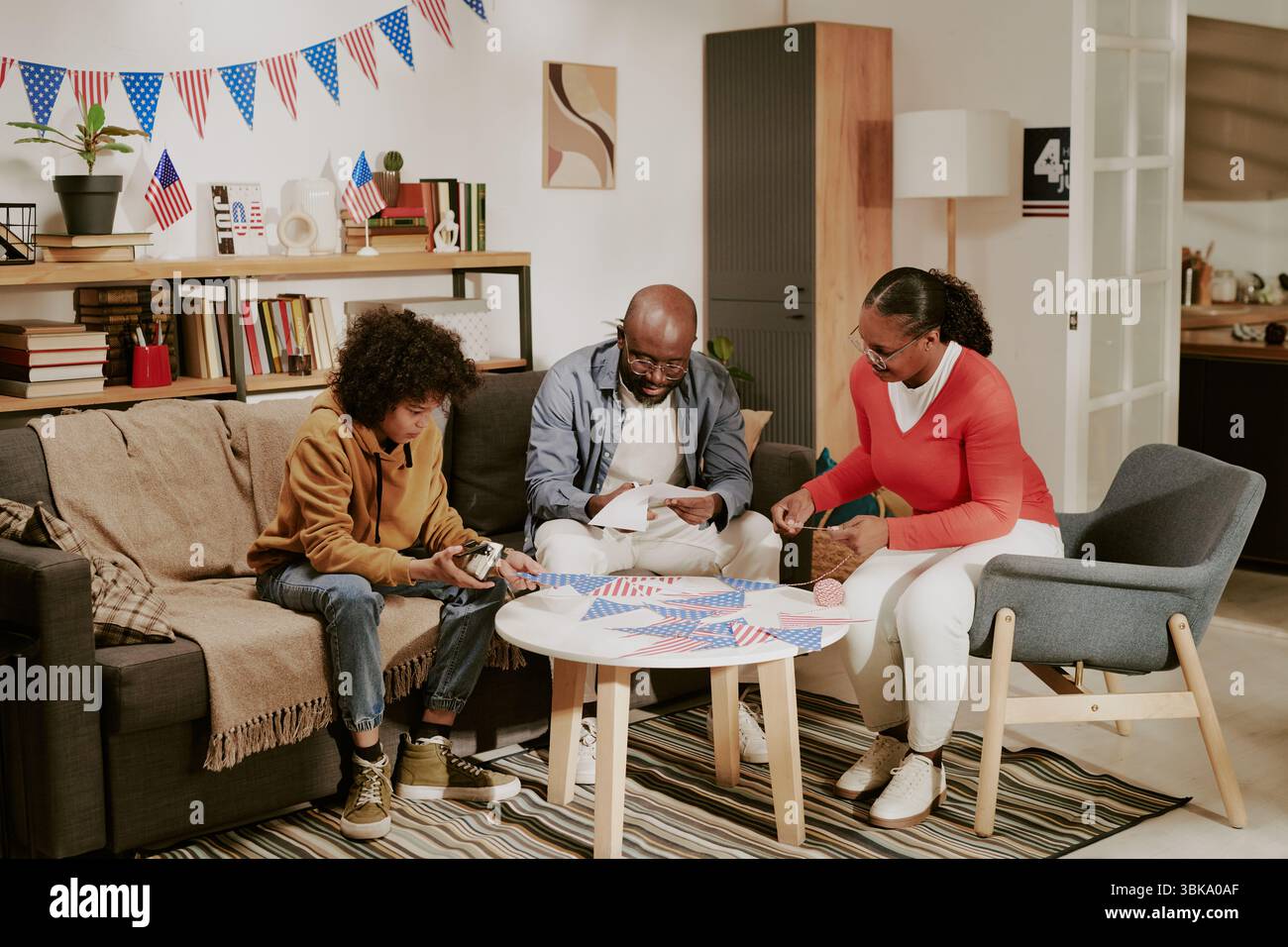 Family Creating Patriotic Crafts Together in Living Room Setting Stock ...