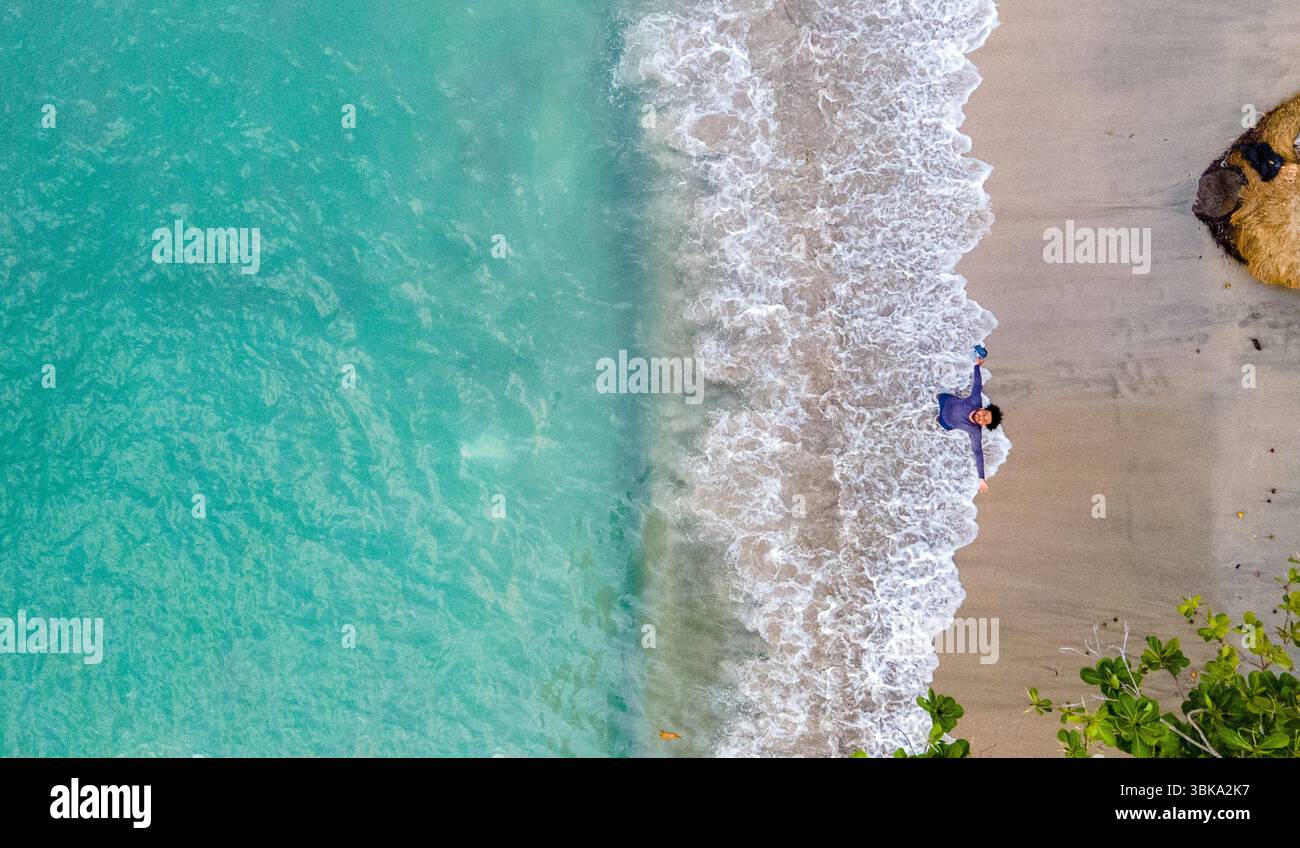 Aerial view of a serene beach in Sapzurro, Choco, Colombia, featuring ...