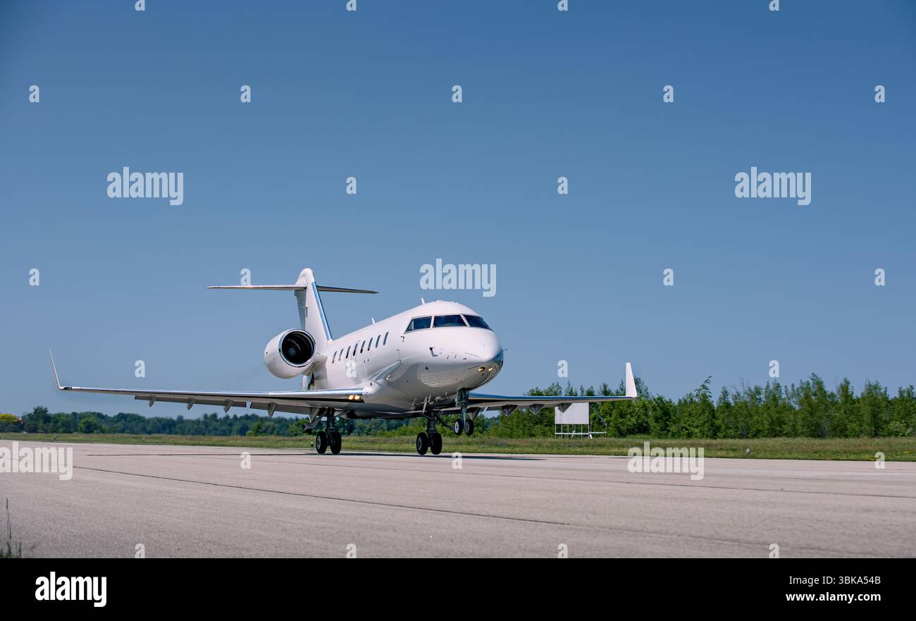 Aircraft taxiing on runway under hi-res stock photography and images ...