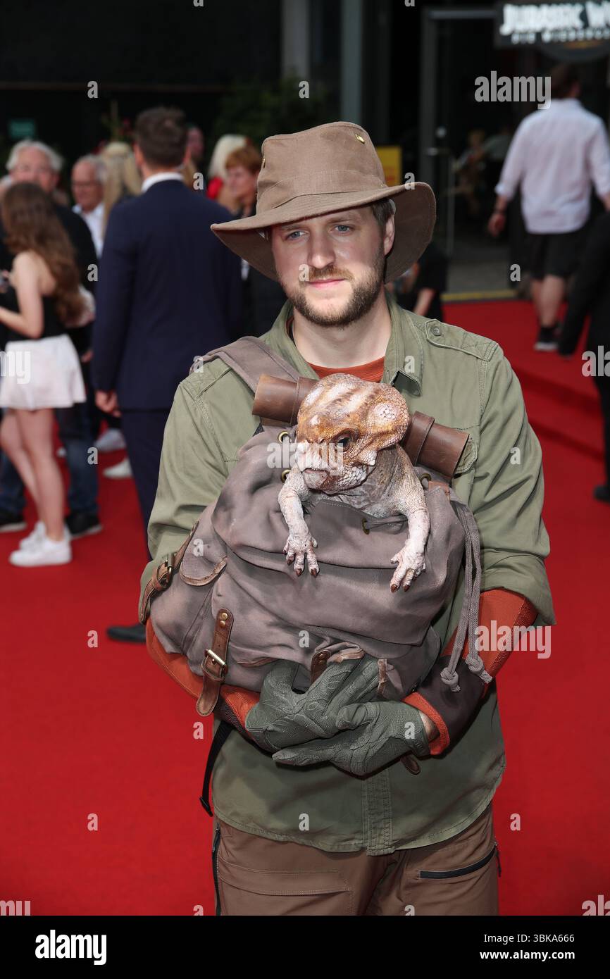Keeper with Mini Dino Doloris attends German premiere of Jurassic World ...