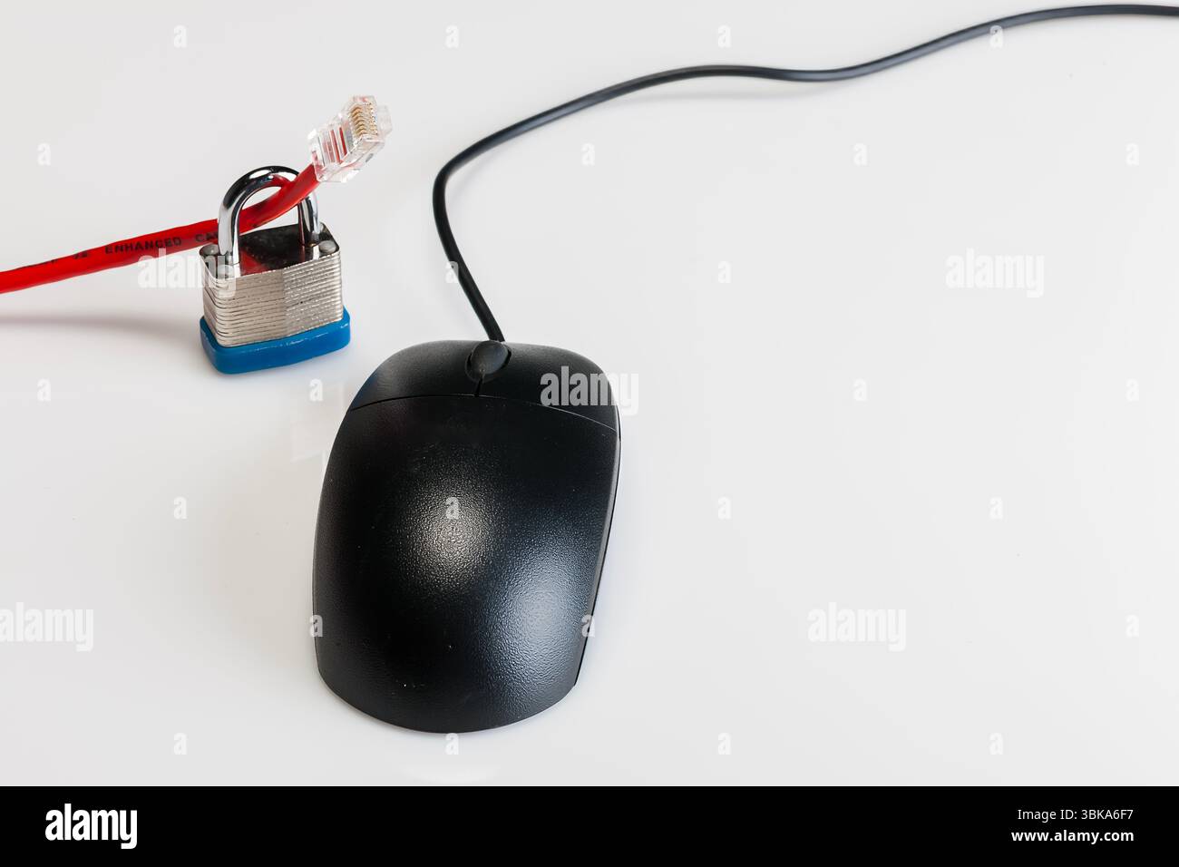 An Ethernet cable with a padlock and computer mouse wrapped around its ...
