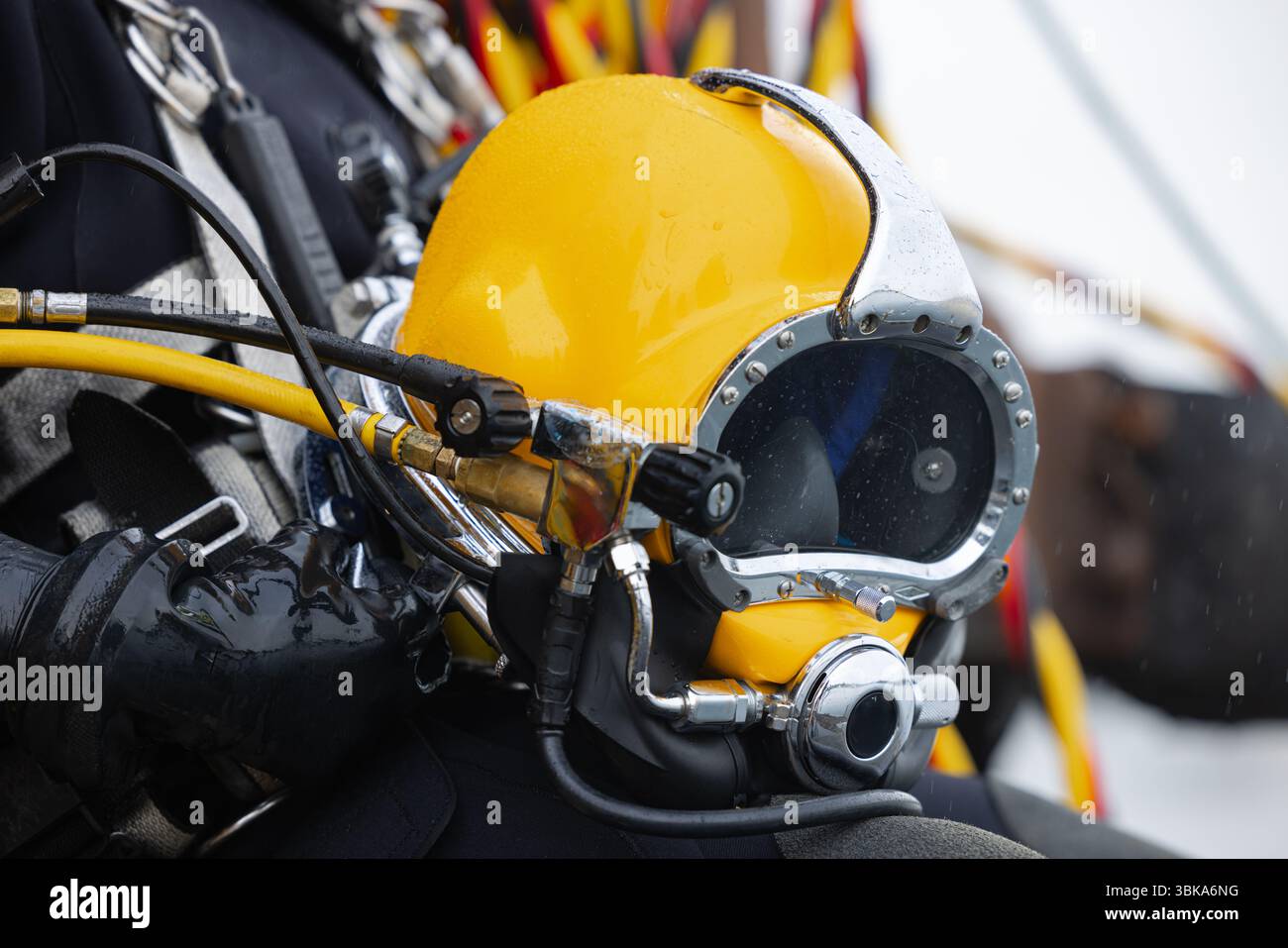Close up of diver holding commercial diving helmet Stock Photo - Alamy