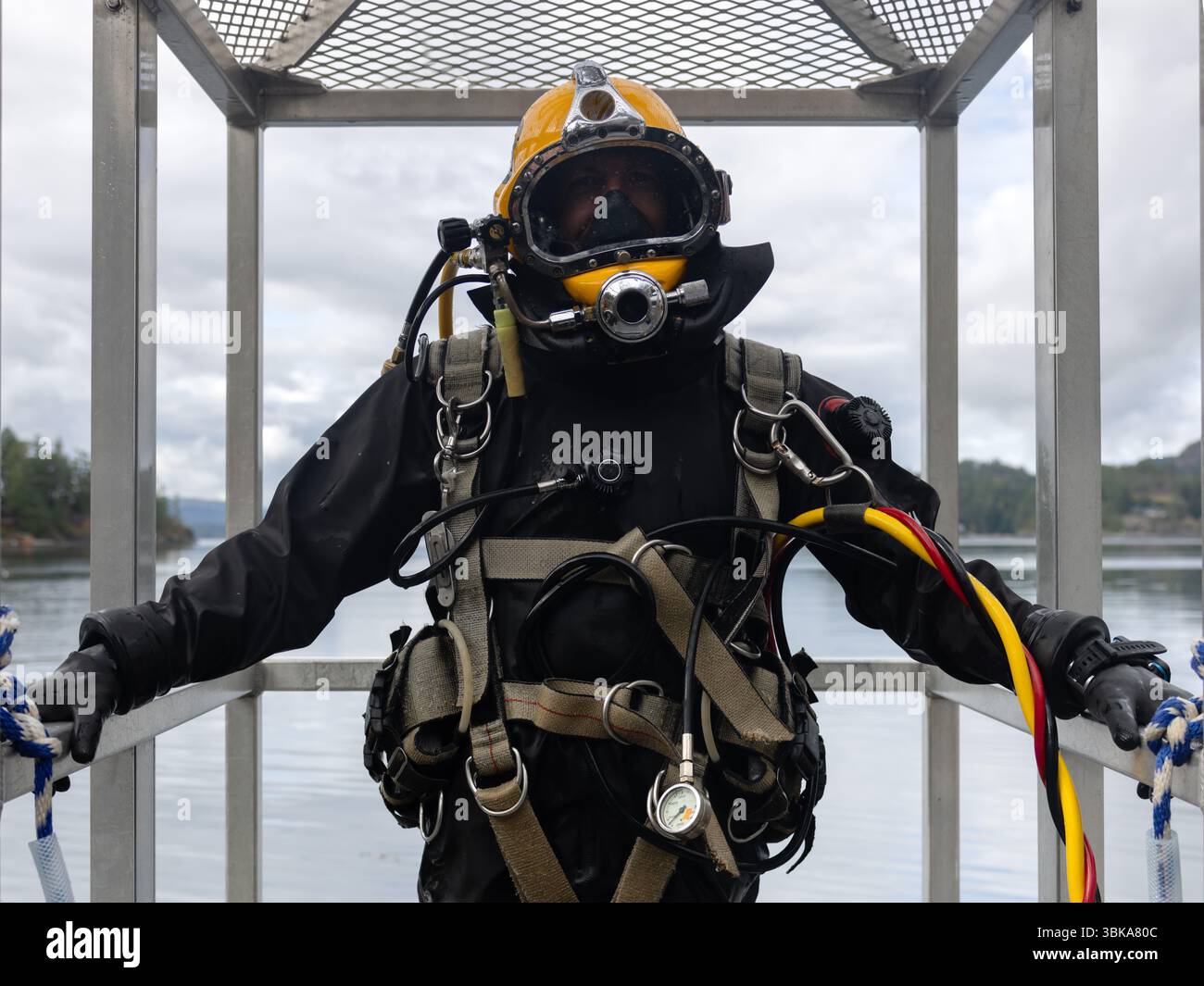 Commercial diver prepared for deep water entry closeup Stock Photo - Alamy