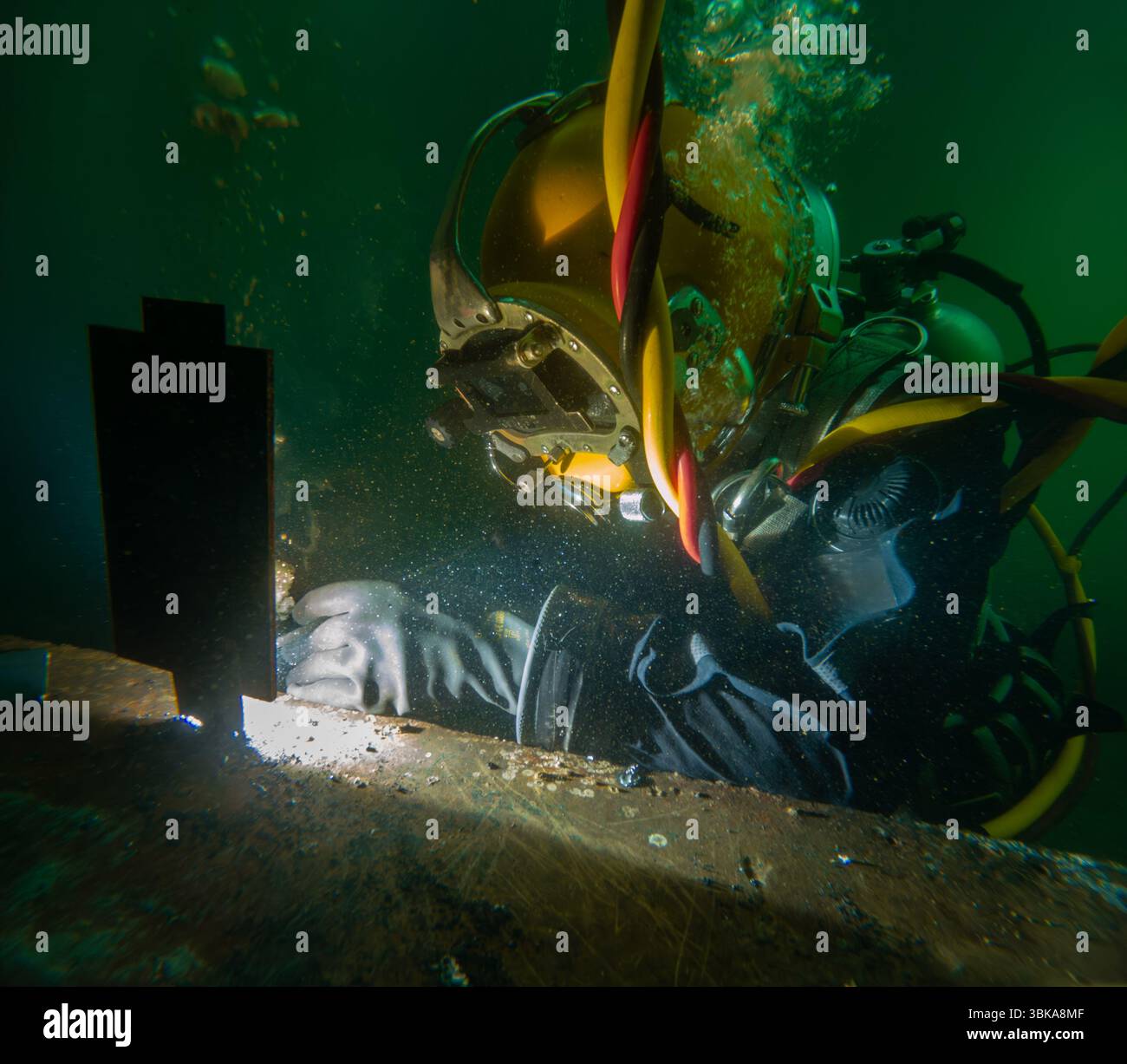 Underwater welding in deep ocean depths closeup Stock Photo - Alamy