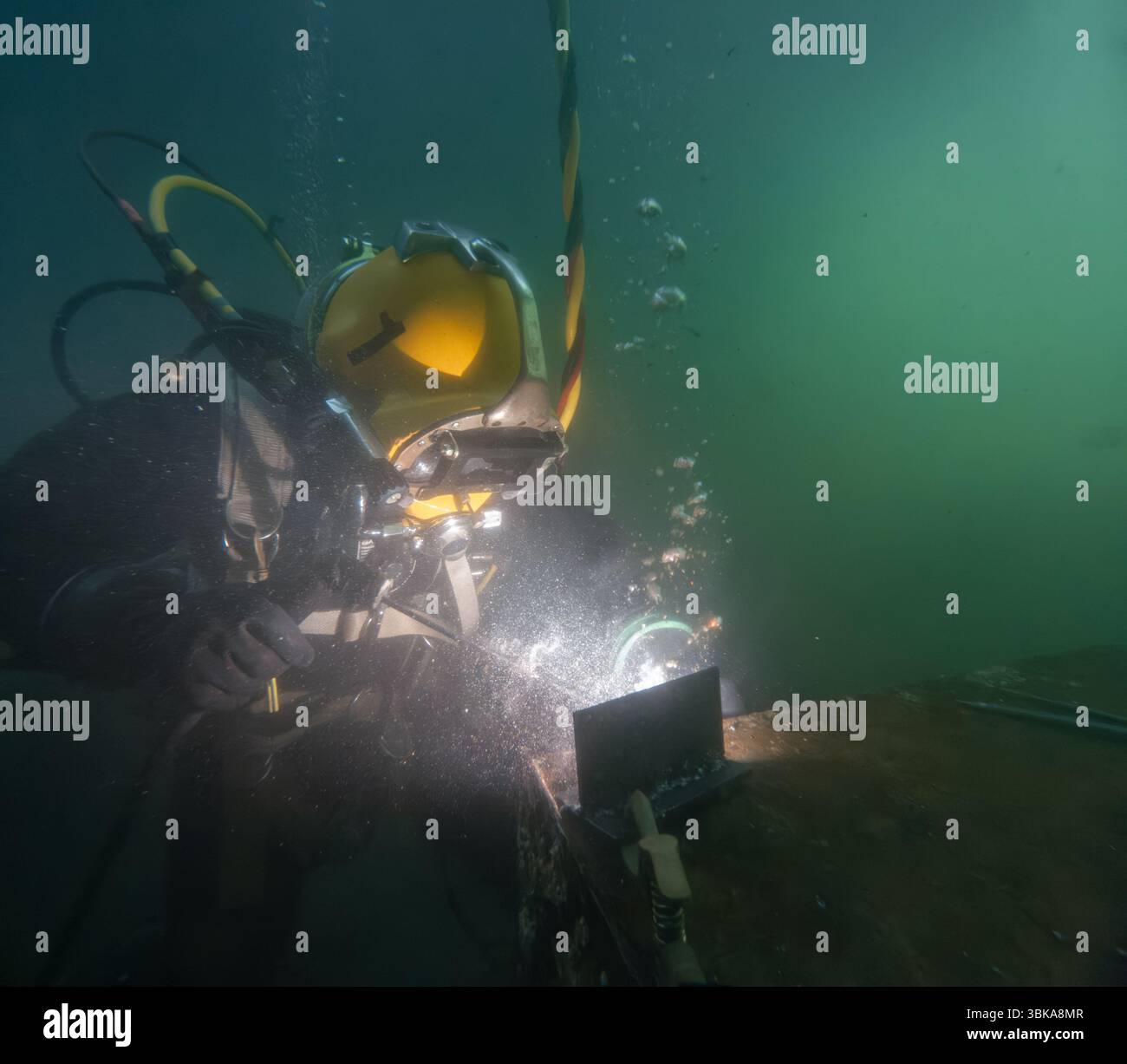 Underwater welding in deep ocean depths closeup Stock Photo - Alamy
