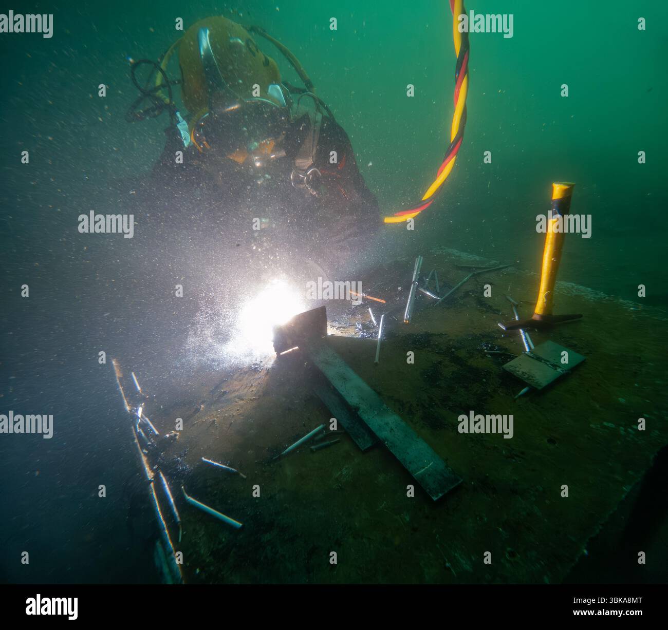 Underwater welding in deep ocean depths closeup Stock Photo - Alamy