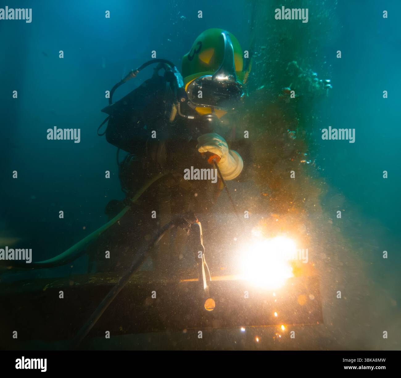 Underwater welding in deep ocean depths closeup Stock Photo - Alamy