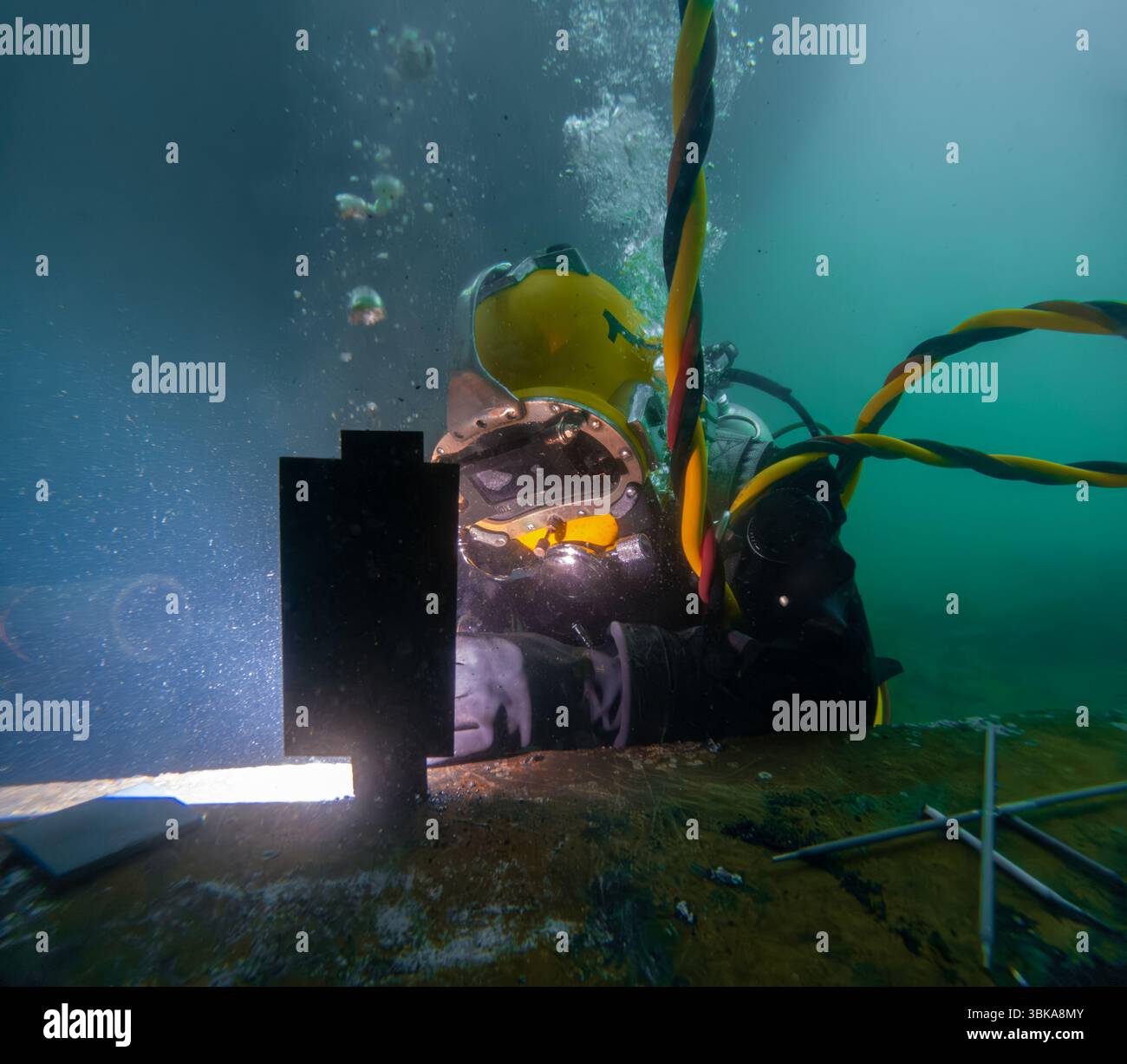 Underwater welding in deep ocean depths closeup Stock Photo - Alamy