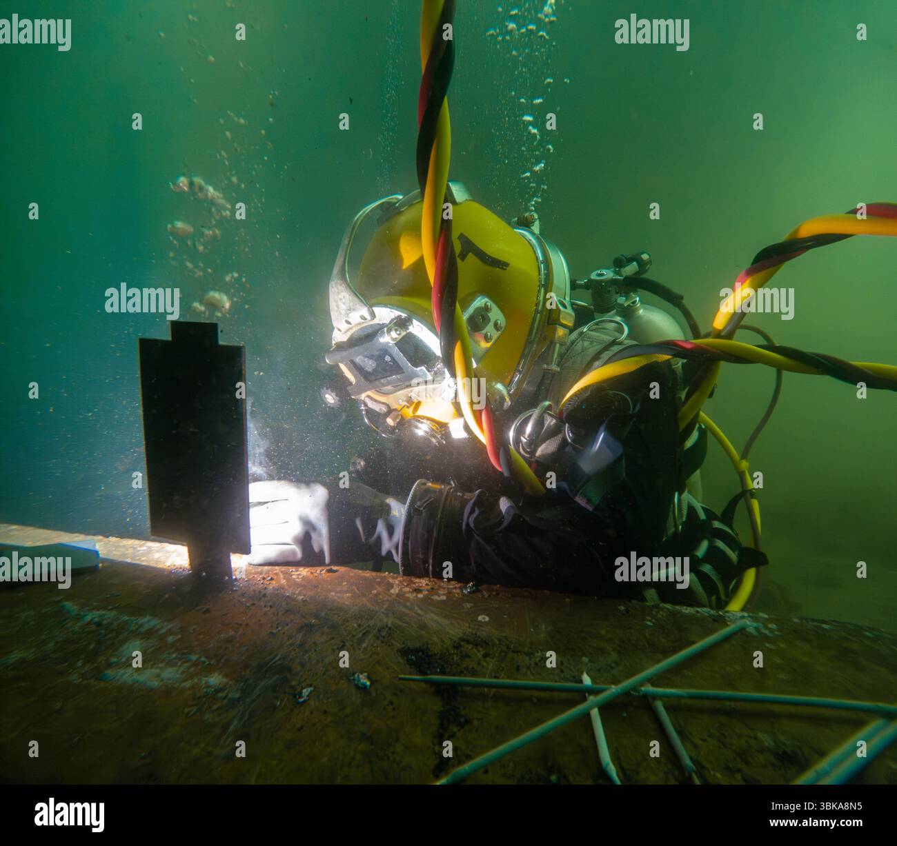 Underwater welding in deep ocean depths closeup Stock Photo - Alamy