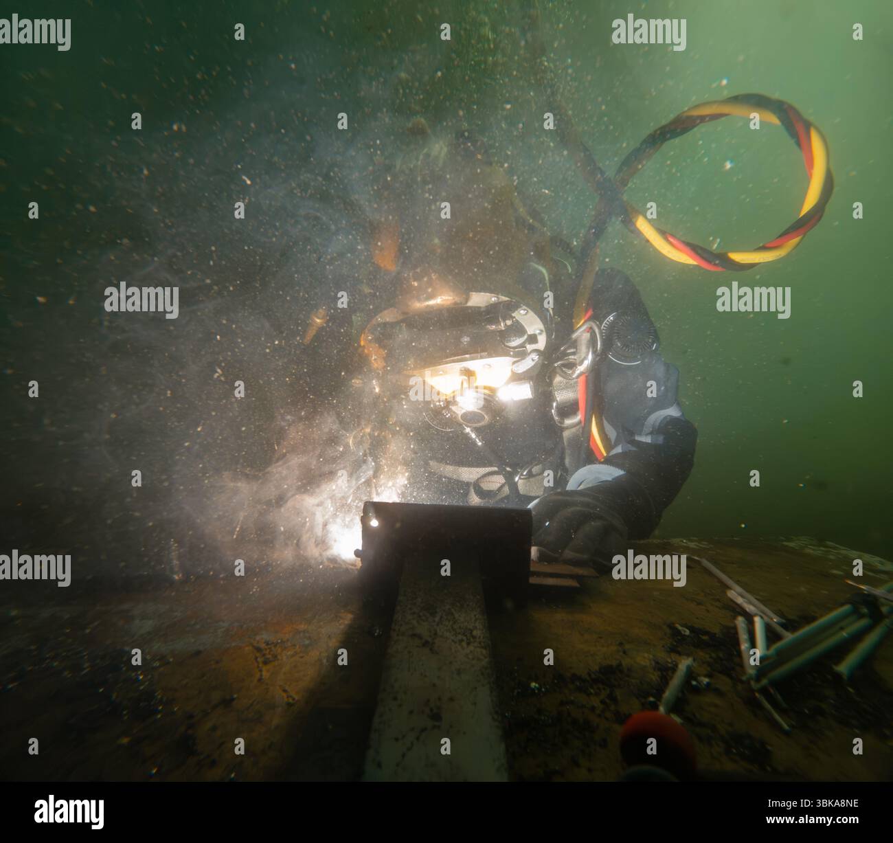 Underwater welding in deep ocean depths closeup Stock Photo - Alamy