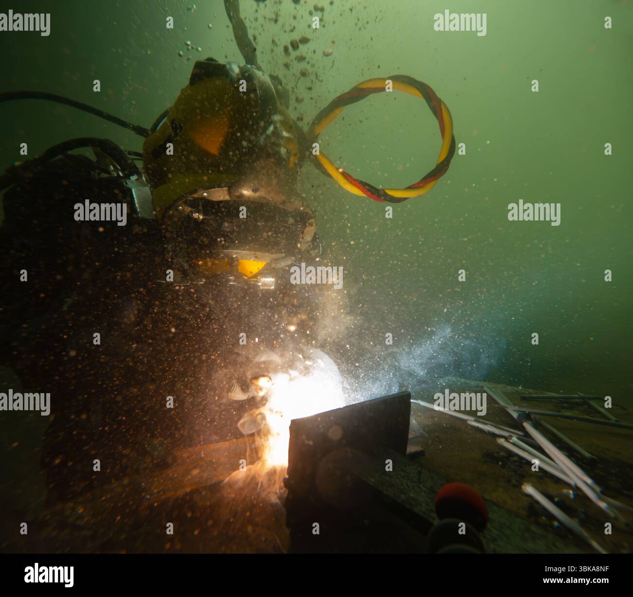 Underwater welding in deep ocean depths closeup Stock Photo - Alamy