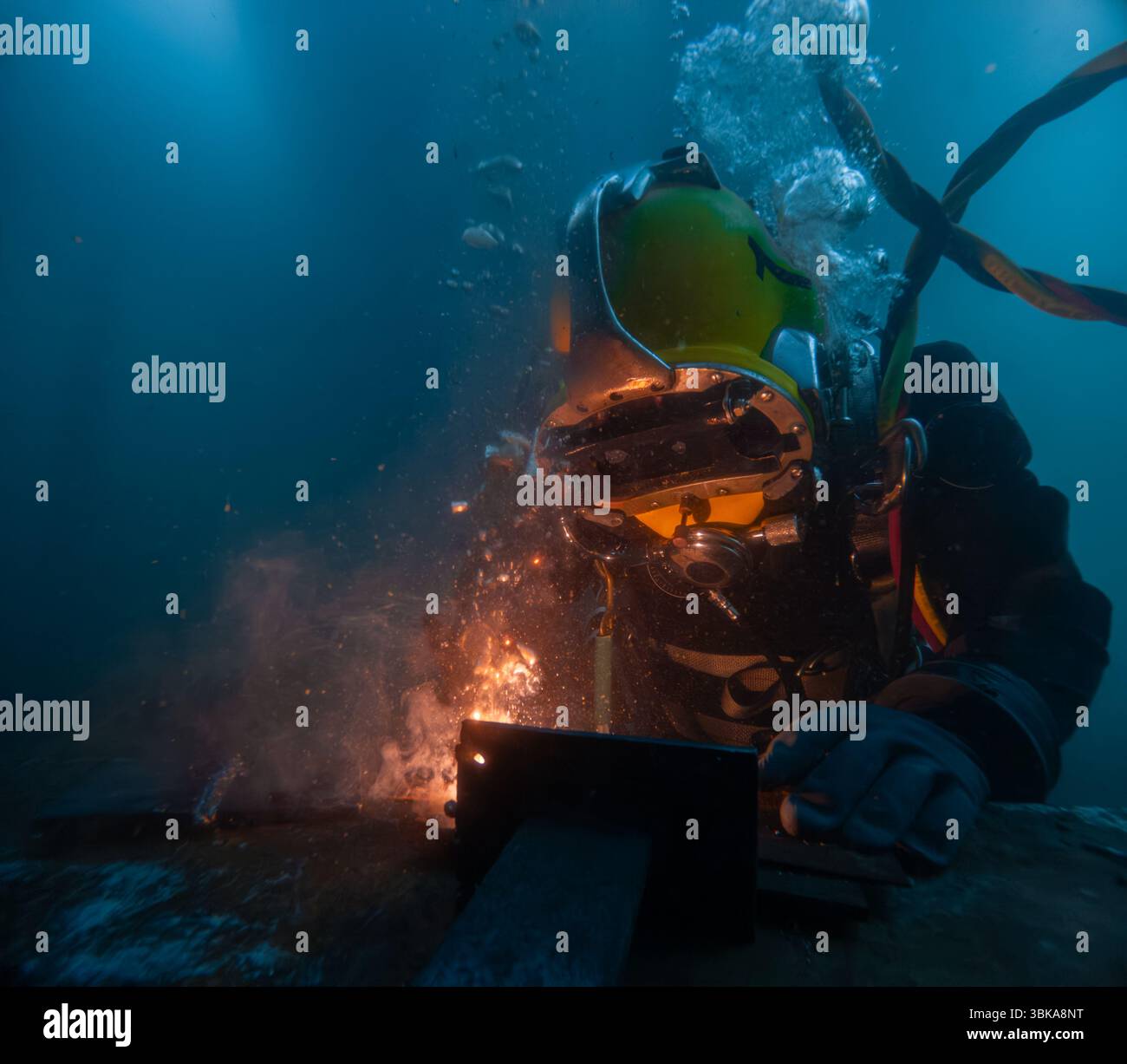 Underwater welding in deep ocean depths closeup Stock Photo - Alamy