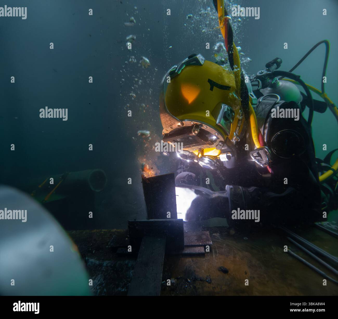 Underwater welding in deep ocean depths closeup Stock Photo - Alamy