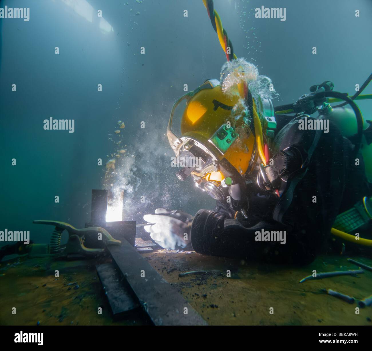 Underwater welding in deep ocean depths closeup Stock Photo - Alamy