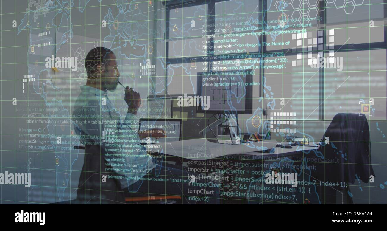 Analyzing code and map overlay on dual monitors in office, African ...