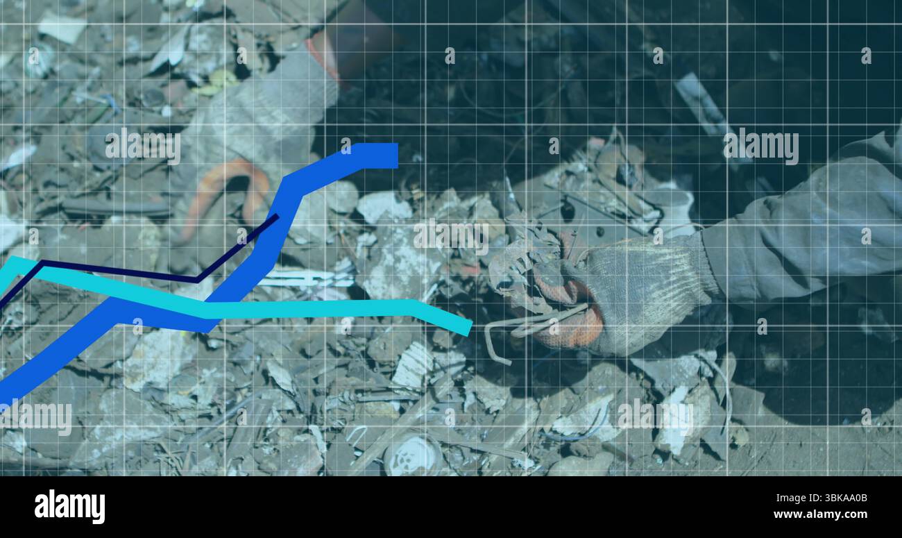 Gloved hands holding rusted component in outdoor scrap yard, with grid ...