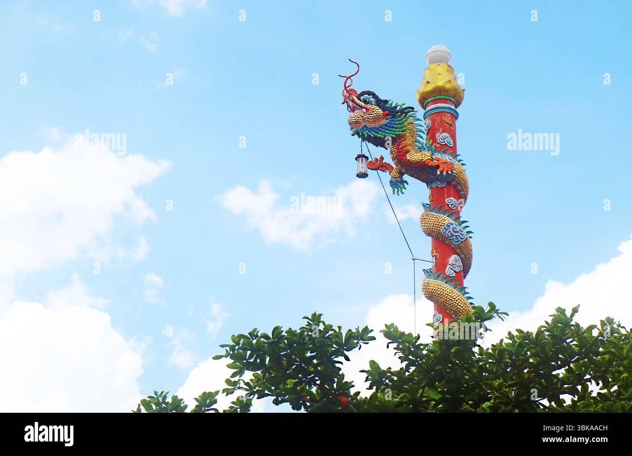 Sculpture of dragon wrapped around a pole in the Chinese temple, a ...